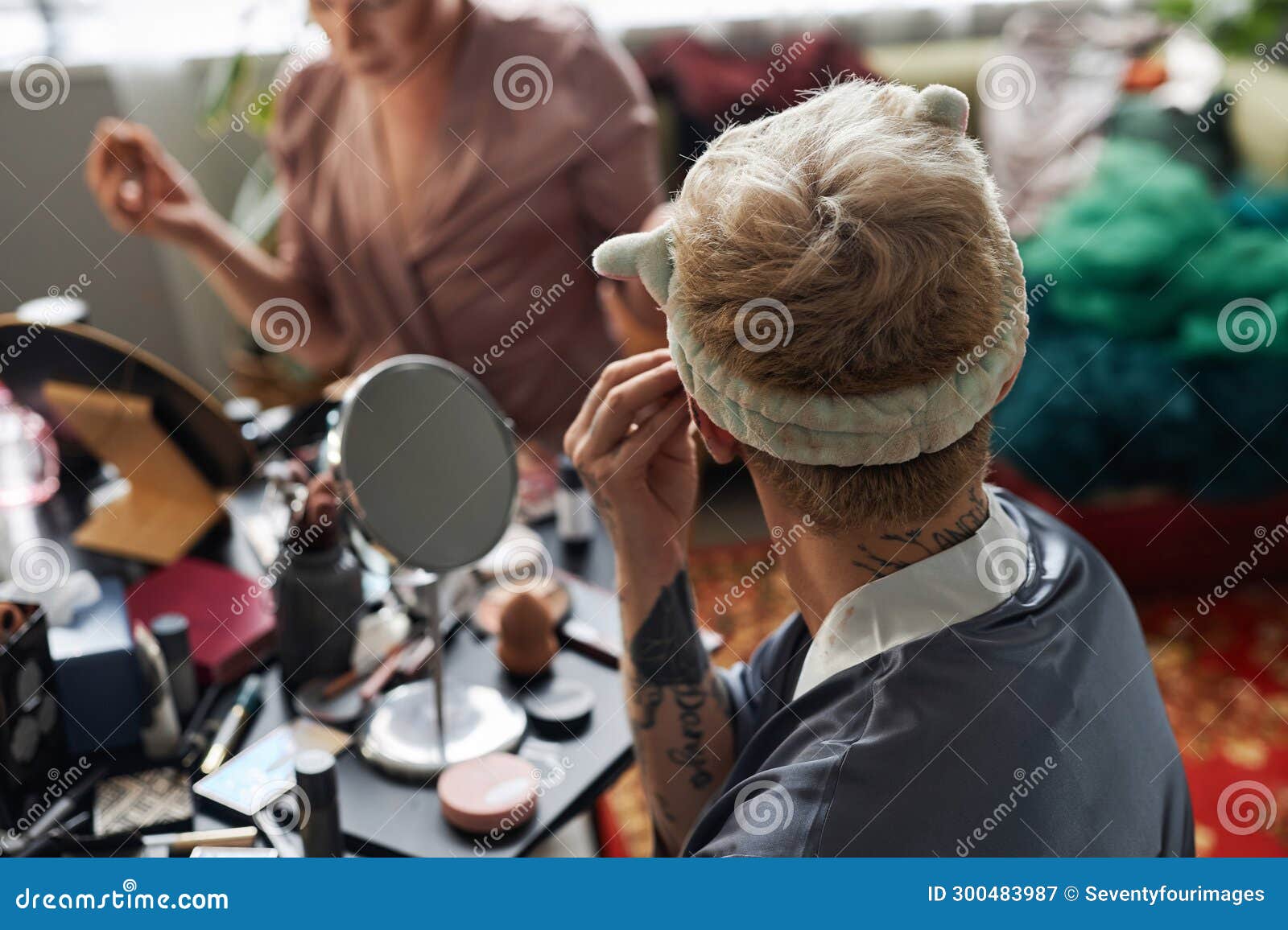 Back View of Young Man Doing Makeup and Looking in Mirror Stock Image ...
