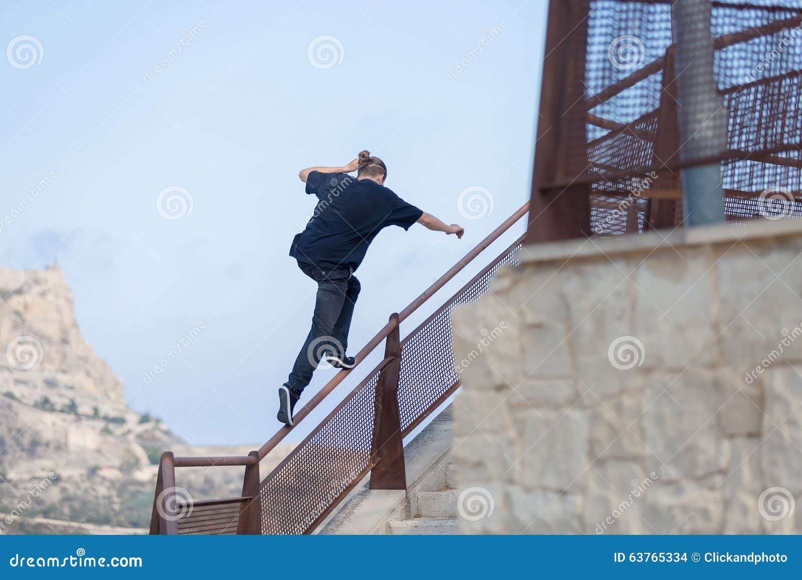 Back View of Young Man Jumping on Railing Stock Photo - Image of adult ...