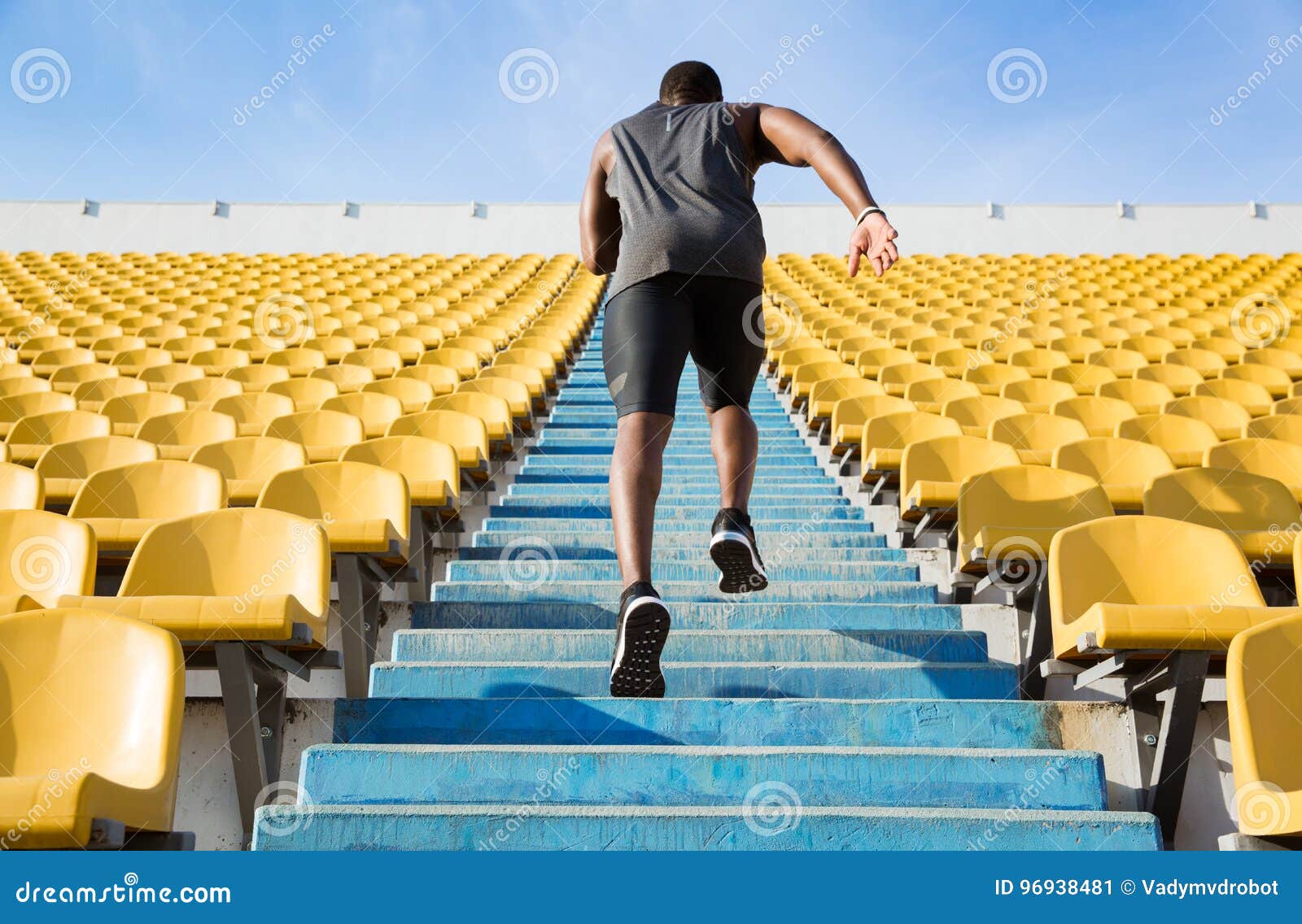 Back View of a Young Man Running Upstairs Stock Image - Image of field ...