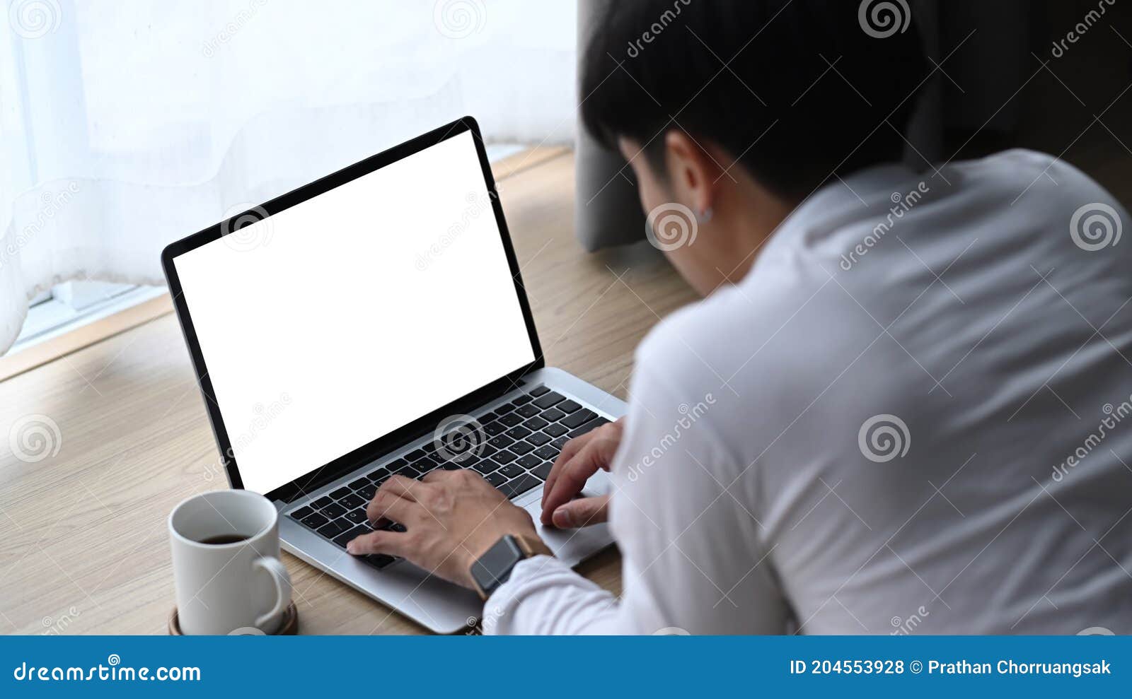 Back View of Young Man Using Laptop while Lying on Floor. Stock Photo ...