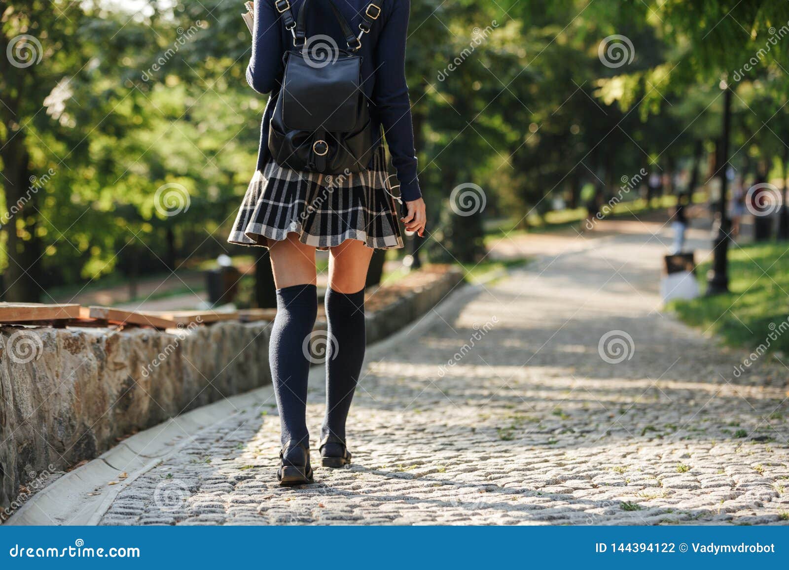 Back View of a Young School Girl Carrying Backpack Stock Photo - Image ...