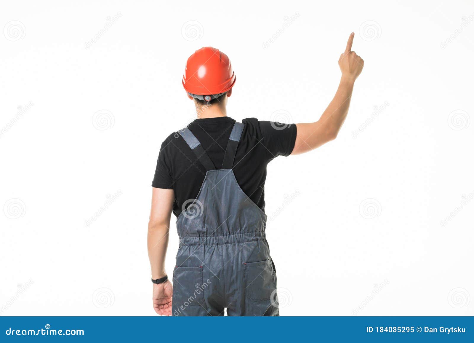Back View of a Young Worker Pointing on White Background Stock Image ...