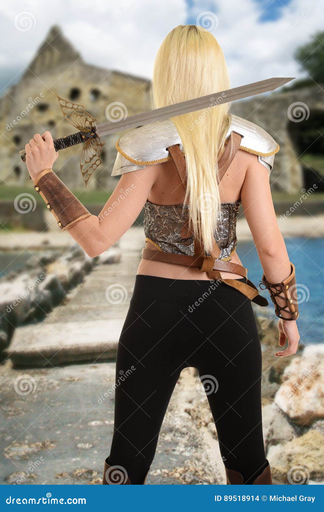Back of Warrior Woman Looking at Ruins Stock Photo - Image of ...