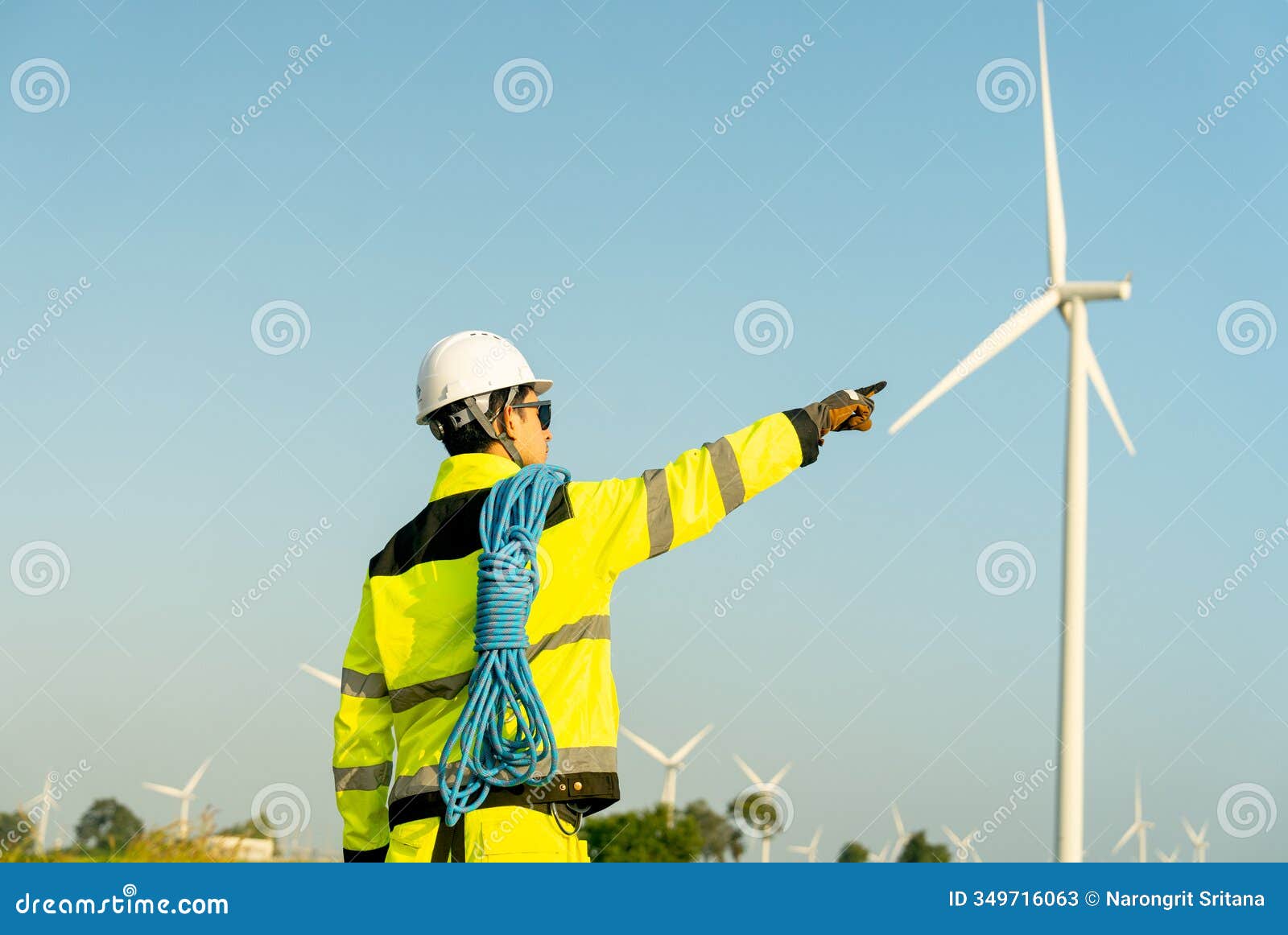 Back of Wind Turbine or Windmill Engineer Worker Point To His Right ...