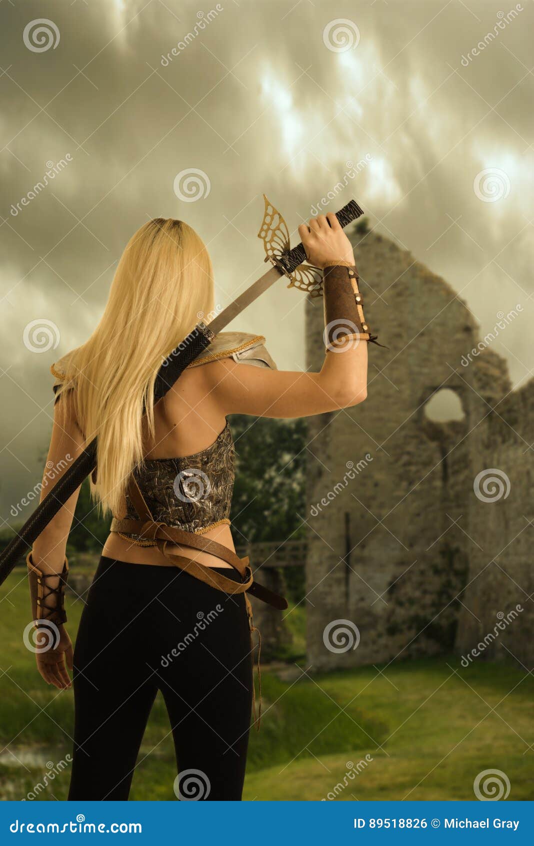 Back of Woman Warrior Drawing Her Sword Stock Photo - Image of building ...