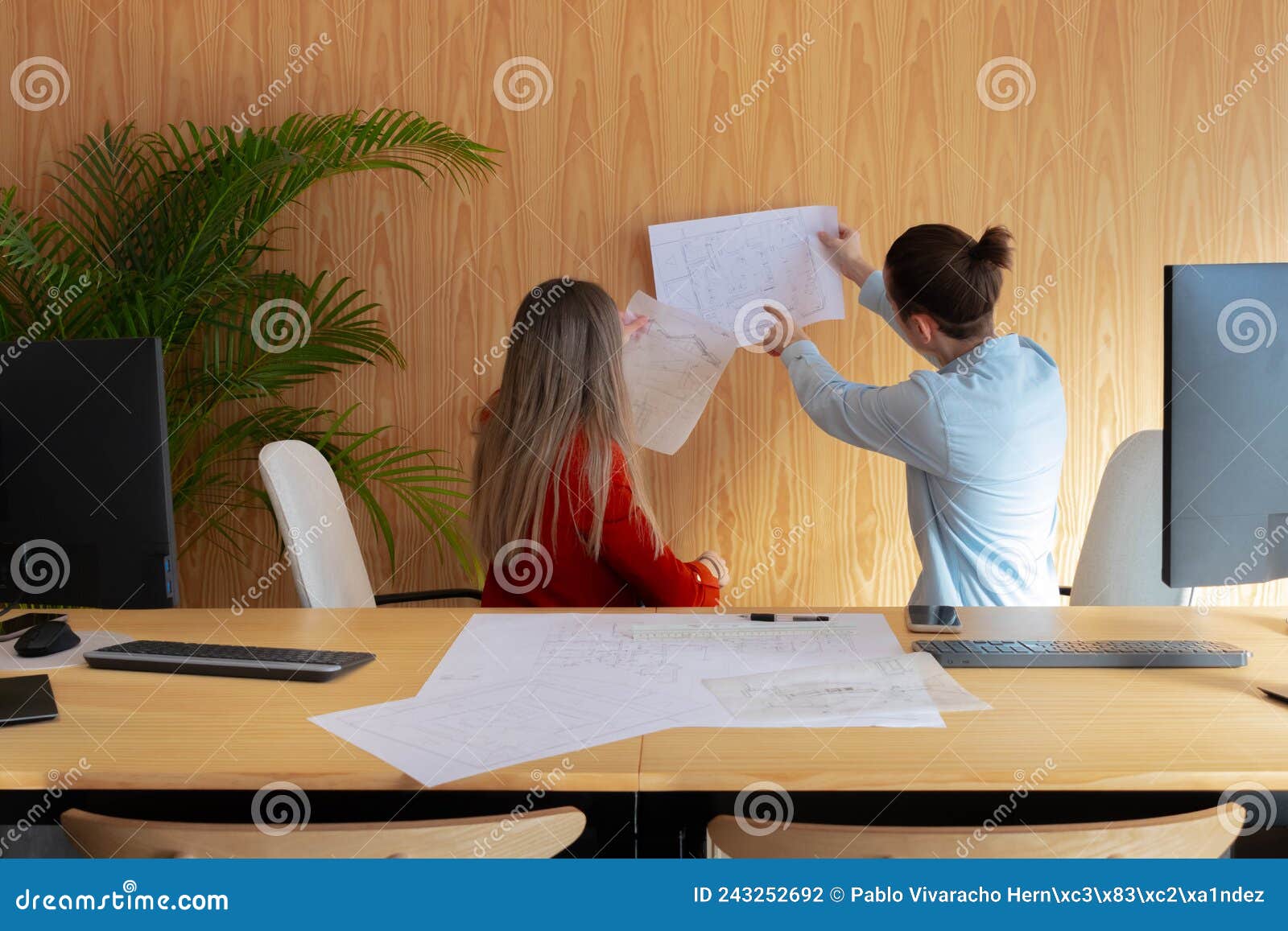 Back Workers with Architectural Sketches and Technical Plans Stock ...