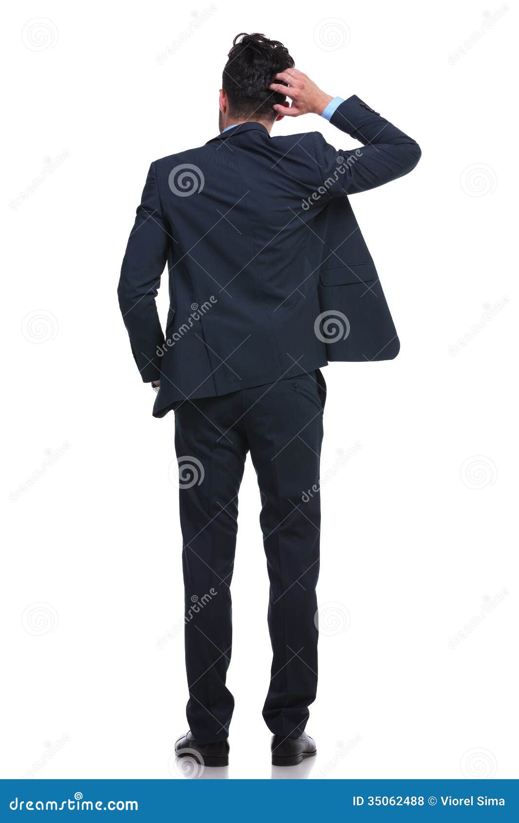 Back of a Young Business Man Scratching His Head Stock Photo - Image of ...