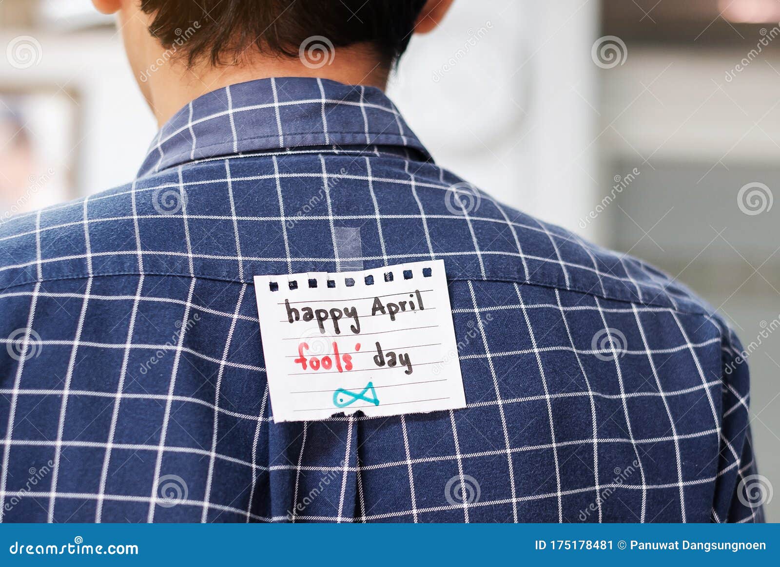 Back of Young Man Office with a White Paper Note Attached with the Text ...