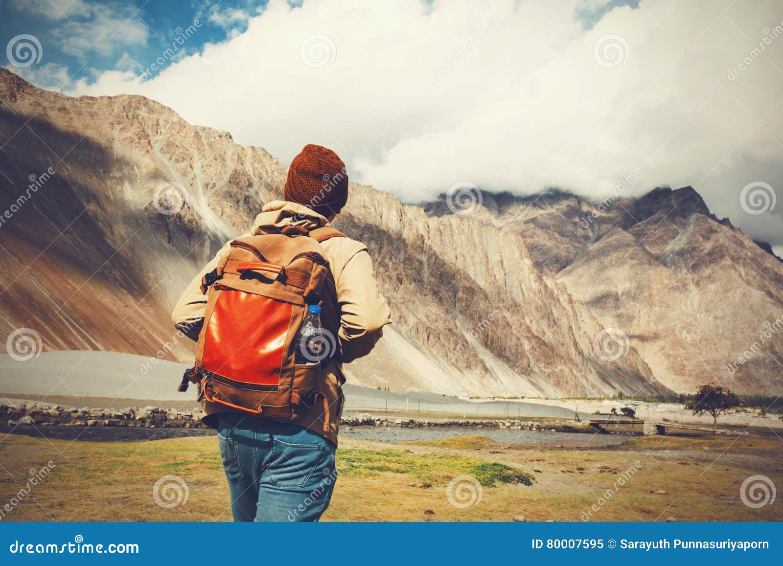 Back of Young Travel Backpacker Walking Towards the Highland Mountain ...