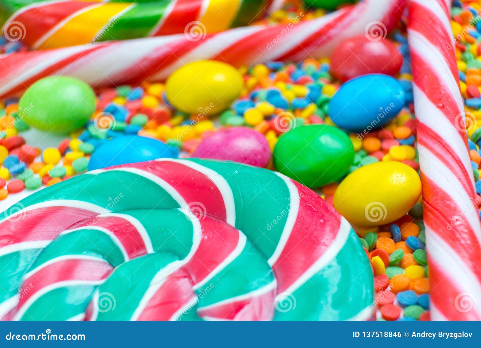 Backdrop of a Bunch Colorful Sweet Candies and Candy Canes Stock Photo ...