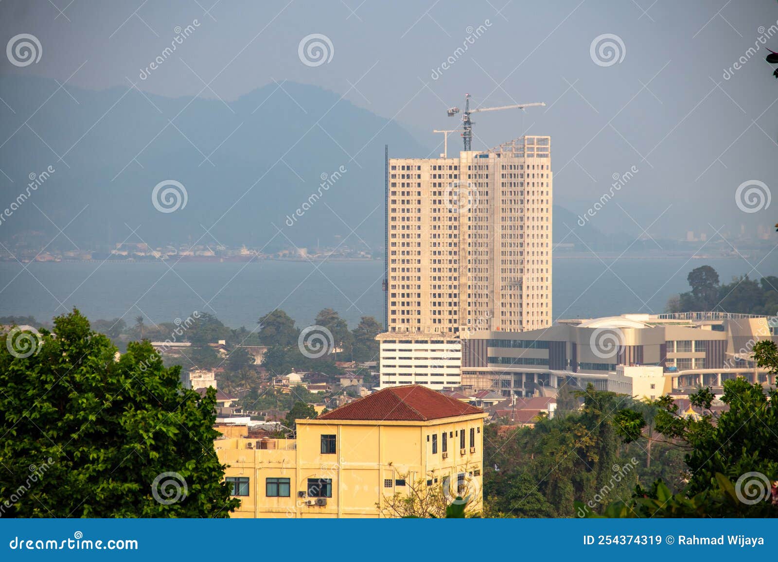 The Backdrop of the Tall White Building on the Outskirts of the City ...