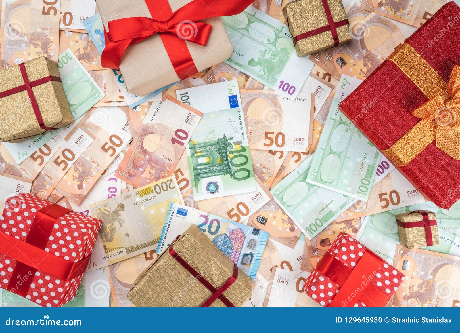 Background from Banknotes of Different Value. Many Gifts in the Shape ...