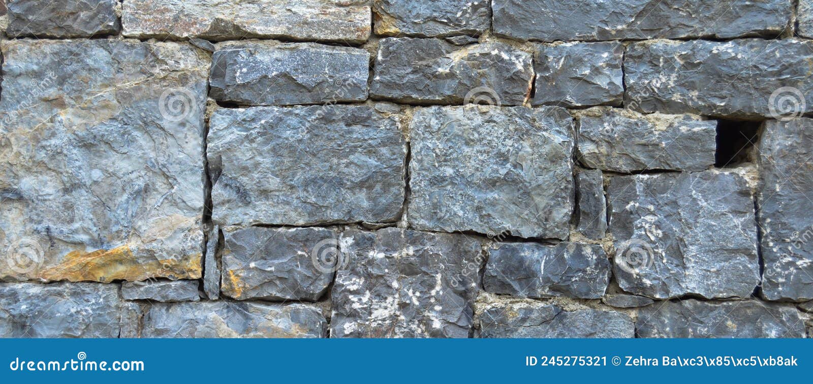 Fine cut blue stone wall stock image. Image of background - 245275321