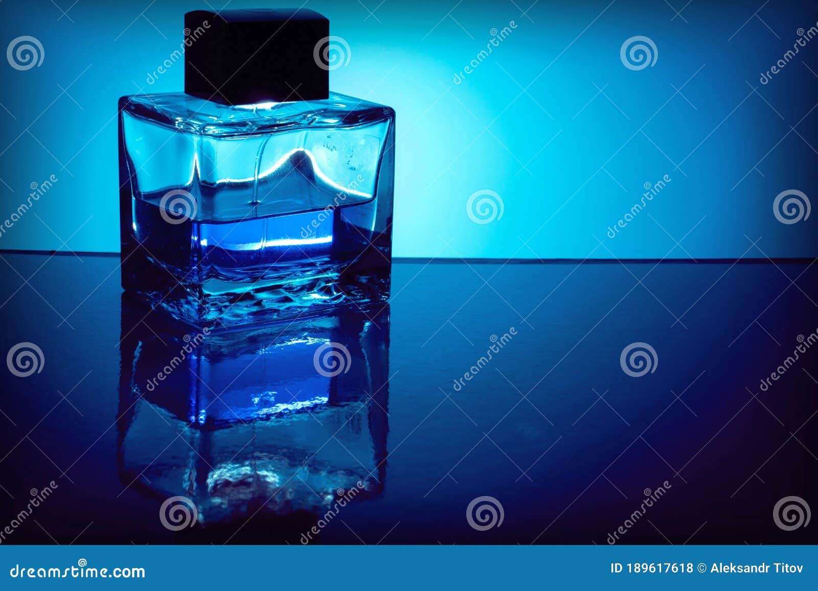 Background with Bottle of Perfume with Blue Liquid, Backlit. Stock ...