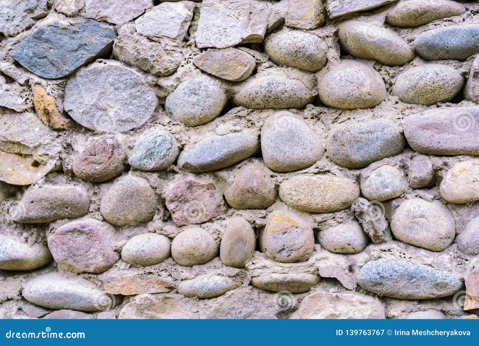 Background from a Brown Natural Round Stone Wall Stock Image - Image of ...