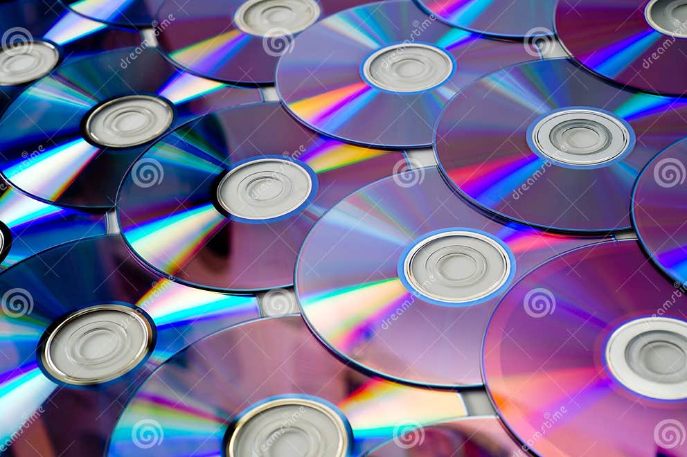 Background of CD and DVD Discs Laid Out on a Flat Surface Stock Photo ...
