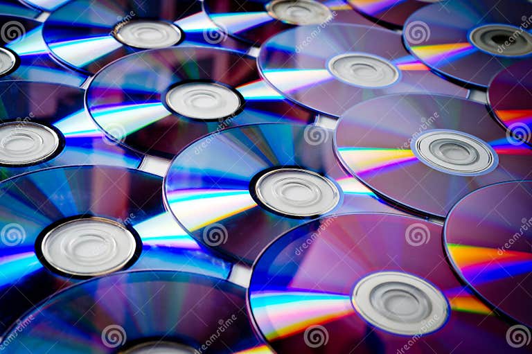Background CD and DVD Discs Laid Out on a Flat Surface. Background for ...