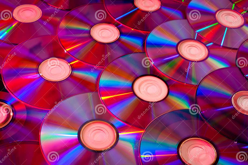 Background CD and DVD Discs Laid Out on a Flat Surface. Background for ...