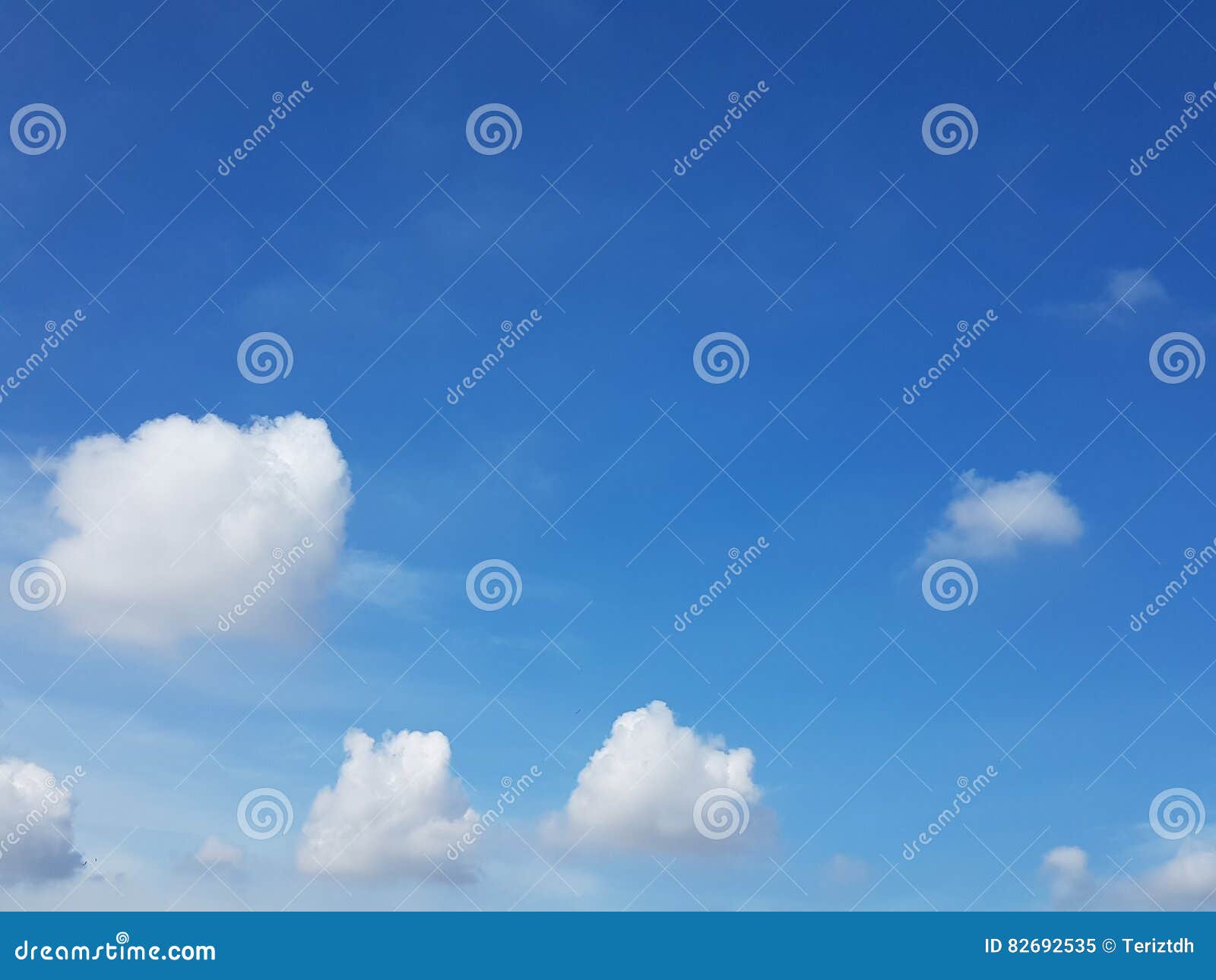 Background of Clear Blue Sky with Small Sparse Puffy Floating White ...