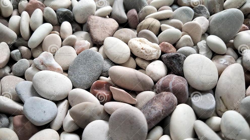 Background of a Collection of Pebbles Arranged in Texture Stock Photo ...