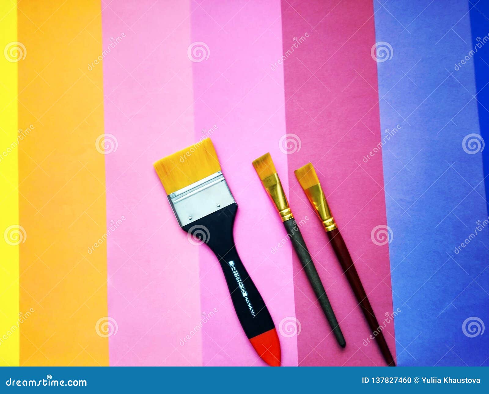 Paint Brushes on a Background of Colored Paper Stock Photo - Image of ...