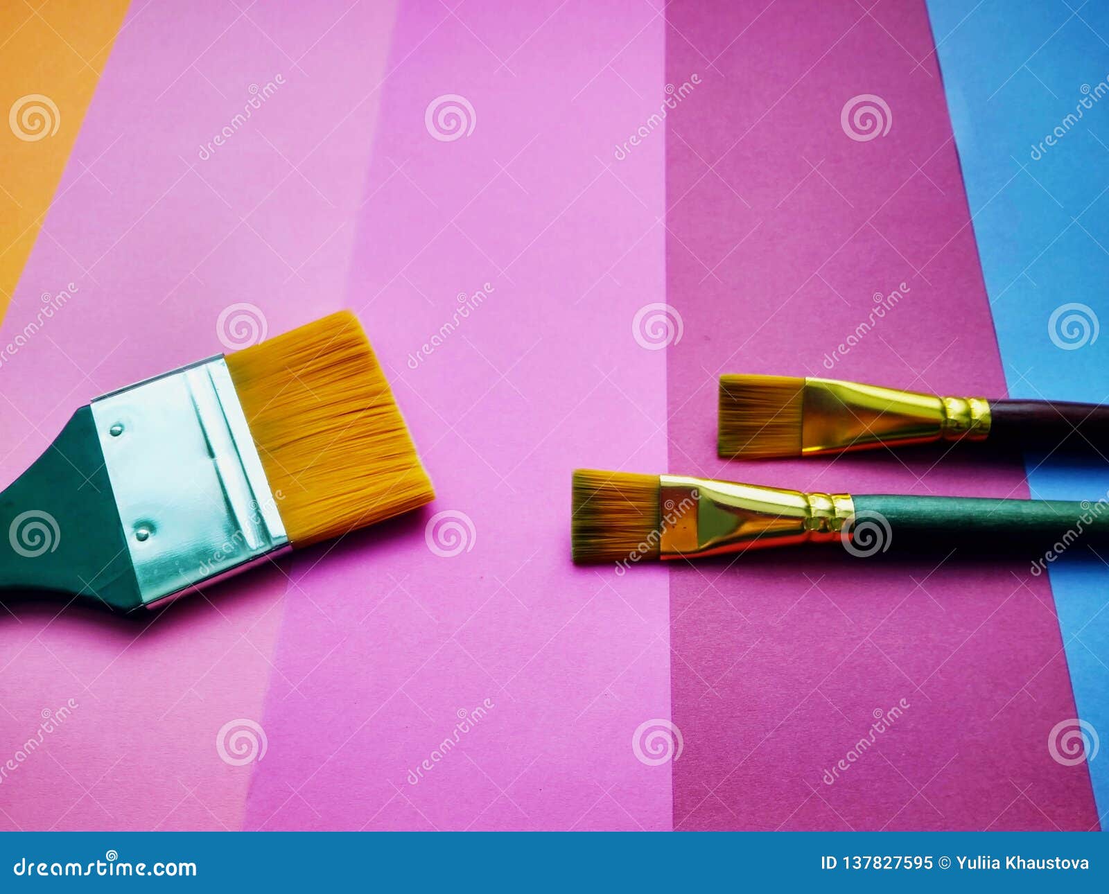 Paint Brushes on a Background of Colored Paper Stock Image - Image of ...
