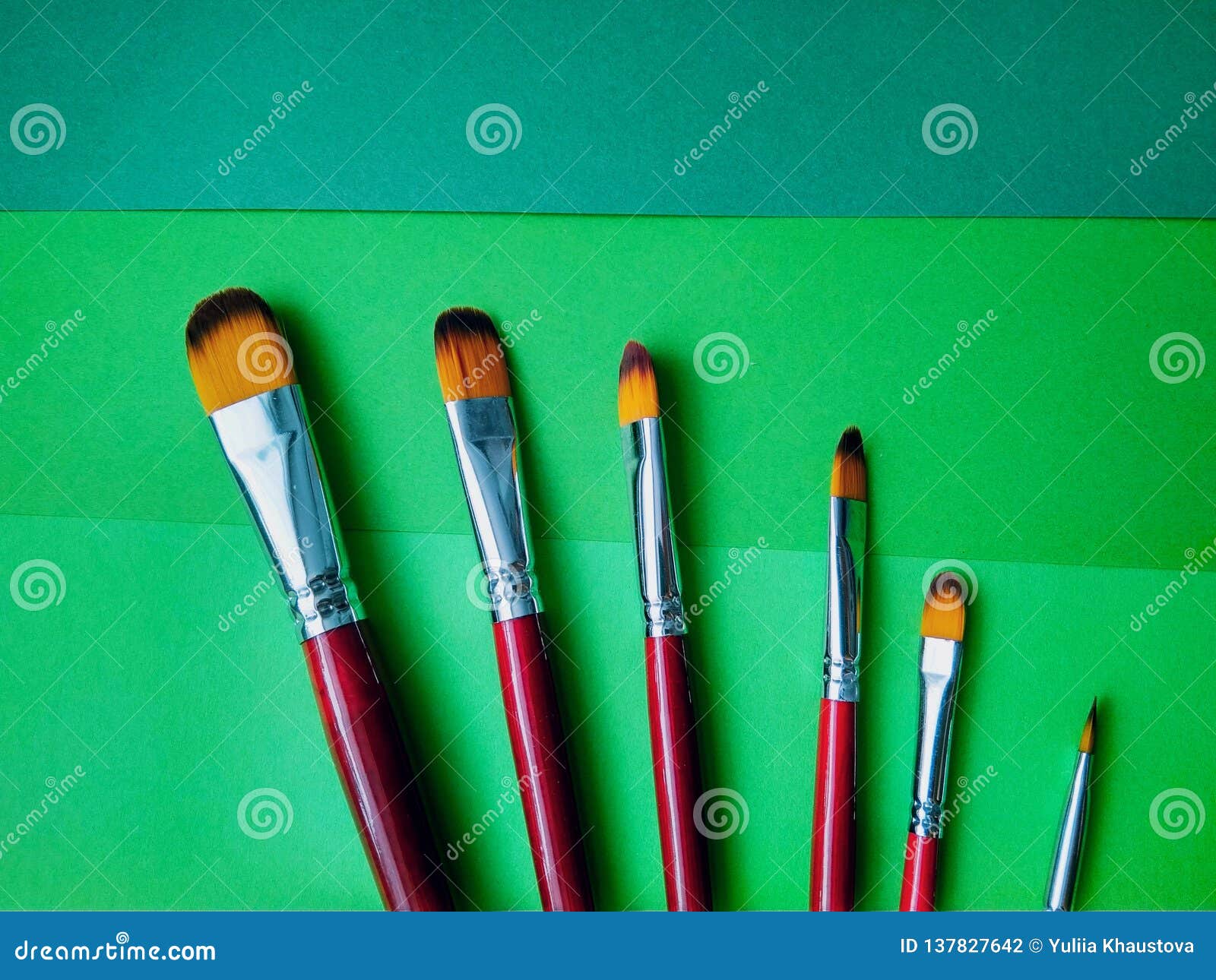 Paint Brushes on a Background of Colored Paper Stock Photo - Image of ...