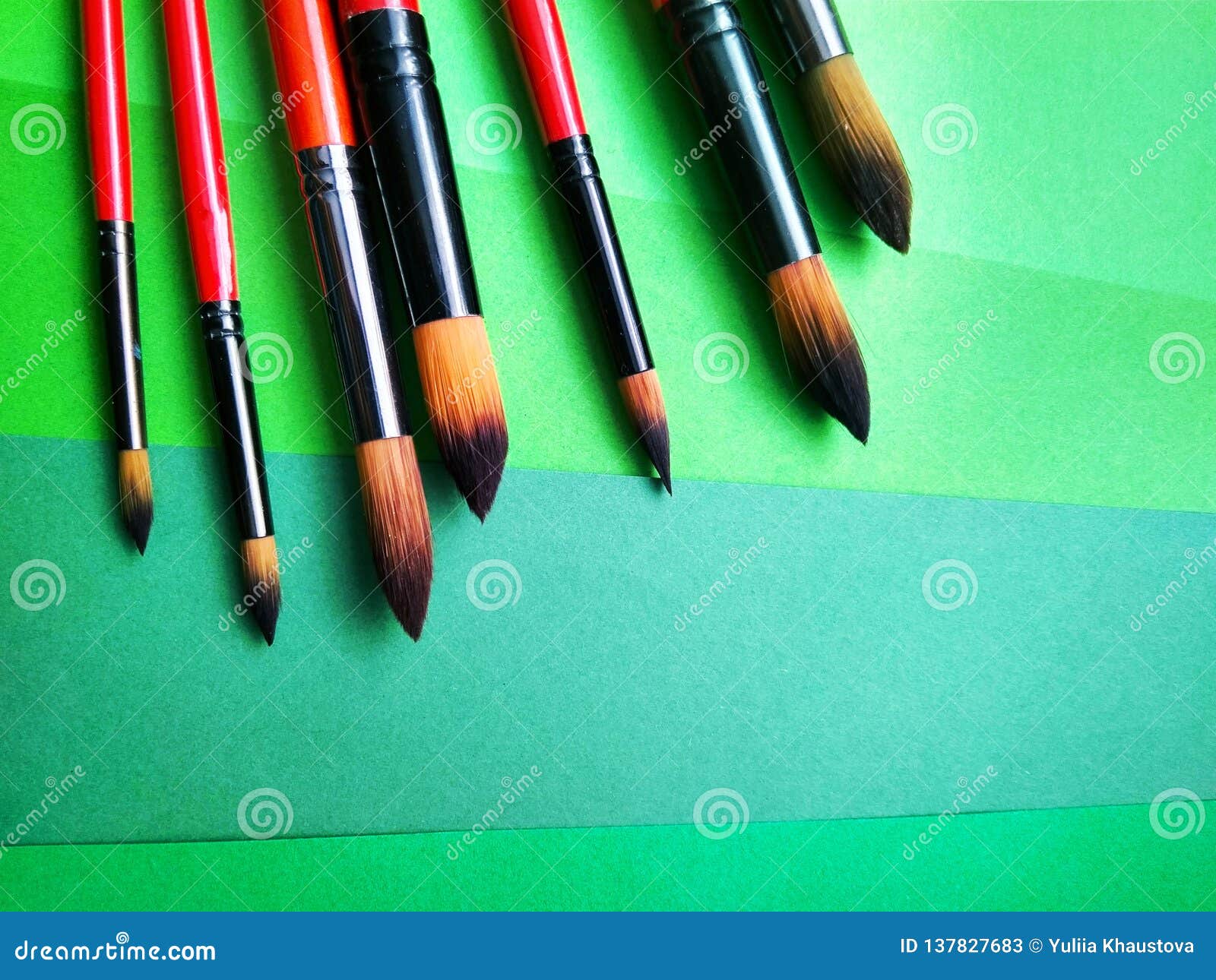 Paint Brushes on a Background of Colored Paper Stock Image - Image of ...
