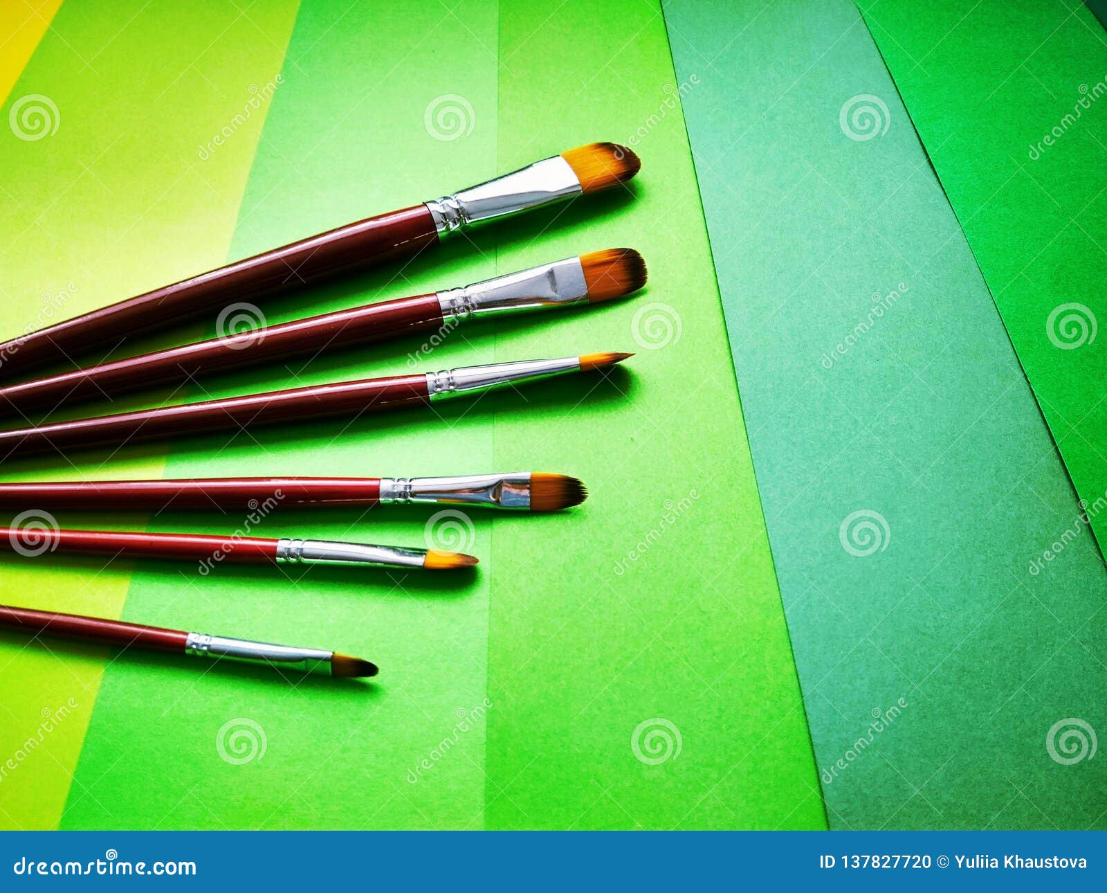 Paint Brushes on a Background of Colored Paper Stock Photo - Image of ...