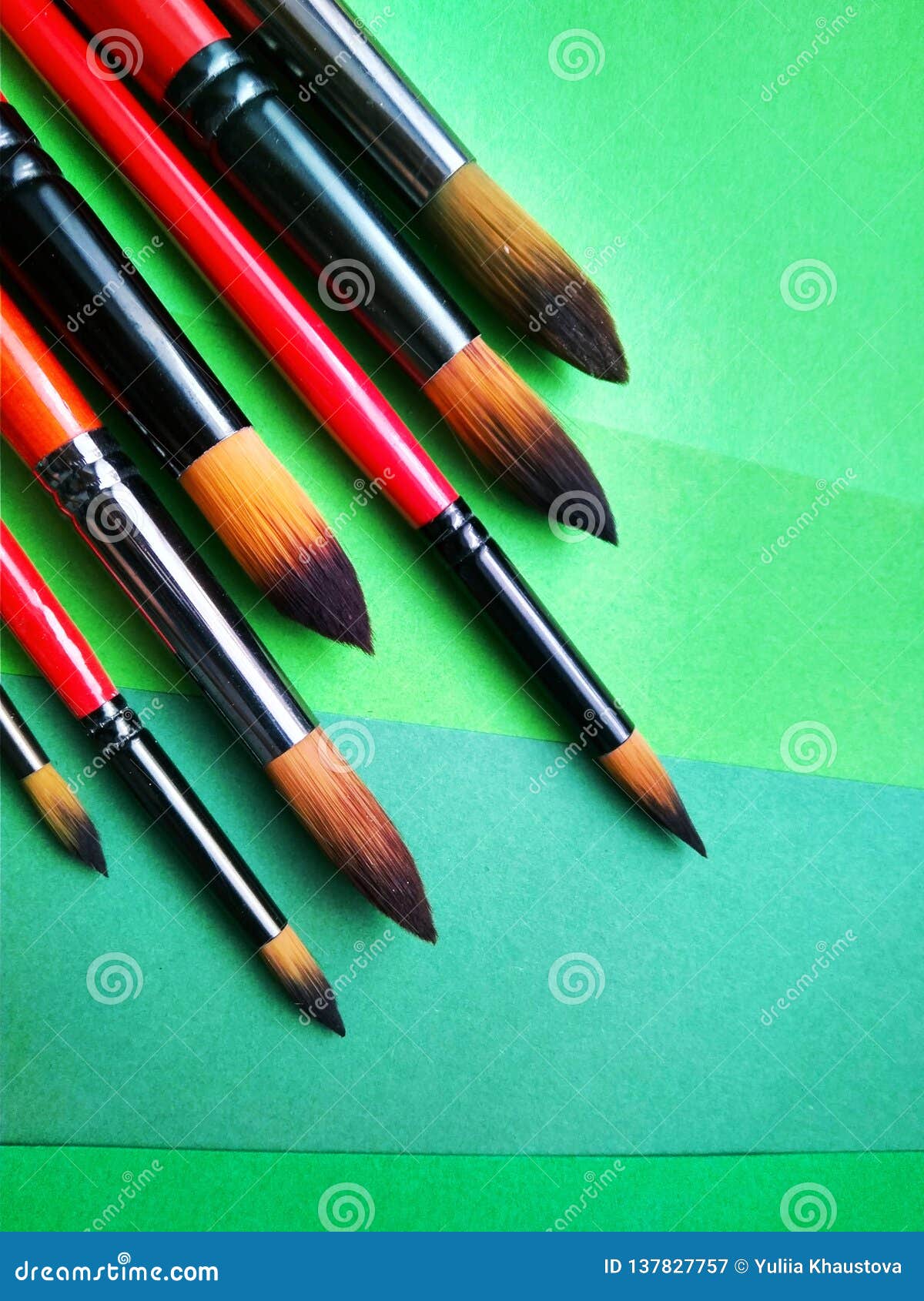 Paint Brushes on a Background of Colored Paper Stock Image - Image of ...