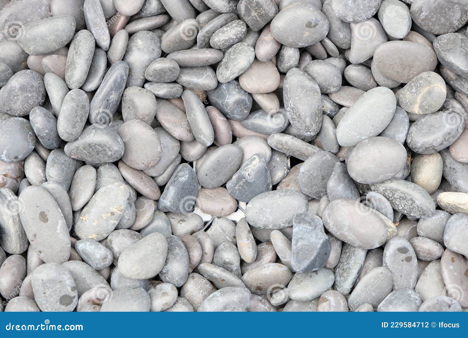 Background of Decorative Light-grey Small Polished Rocks Stock Photo ...