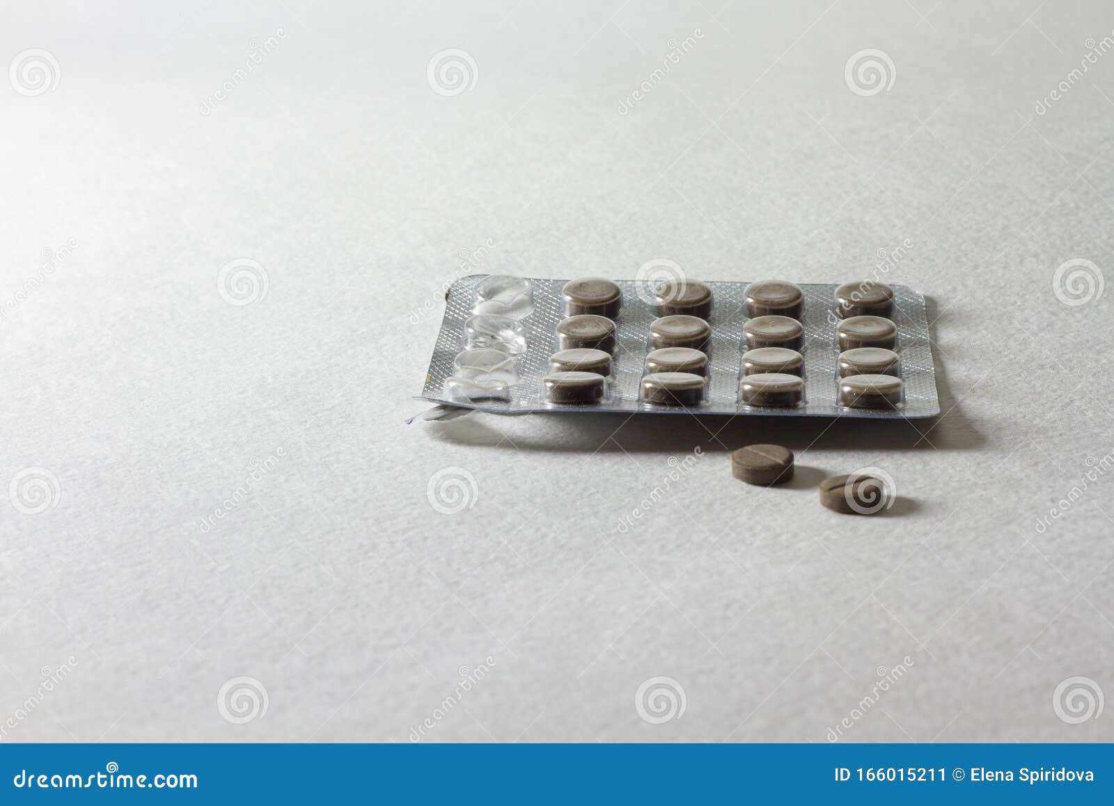 Brown Little Many Tablets with Packaging on a White Light Table ...