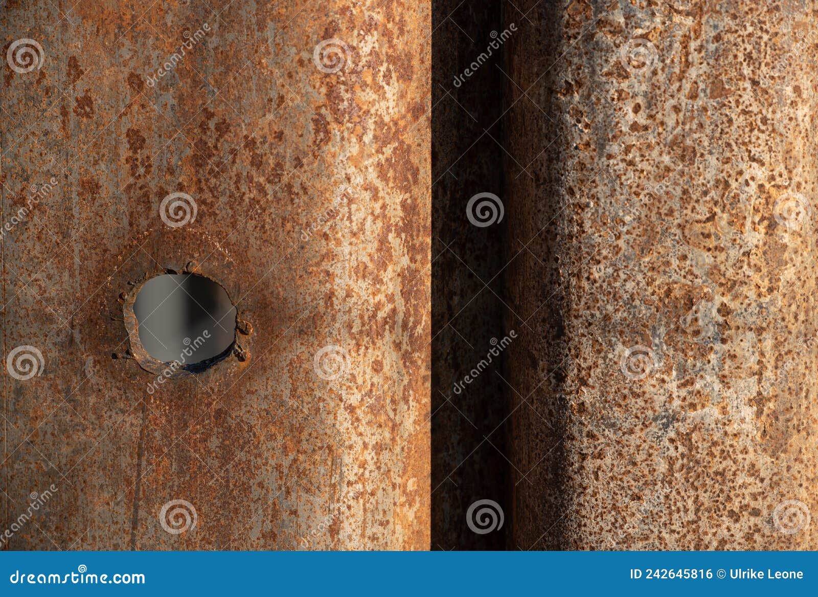 Background and Detail of a Rusty Sheet Piling that Has a Hole Cut in it ...