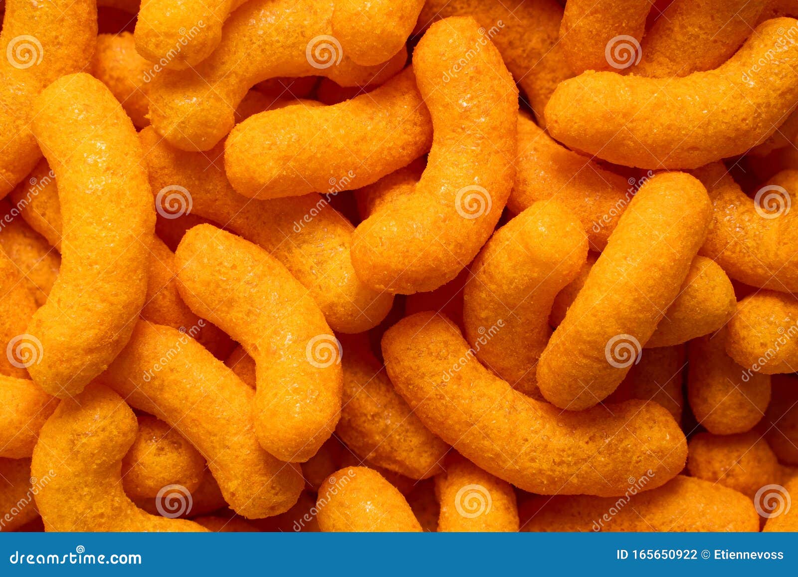 Background of Extruded Cheese Puffs. Top View Stock Photo - Image of ...