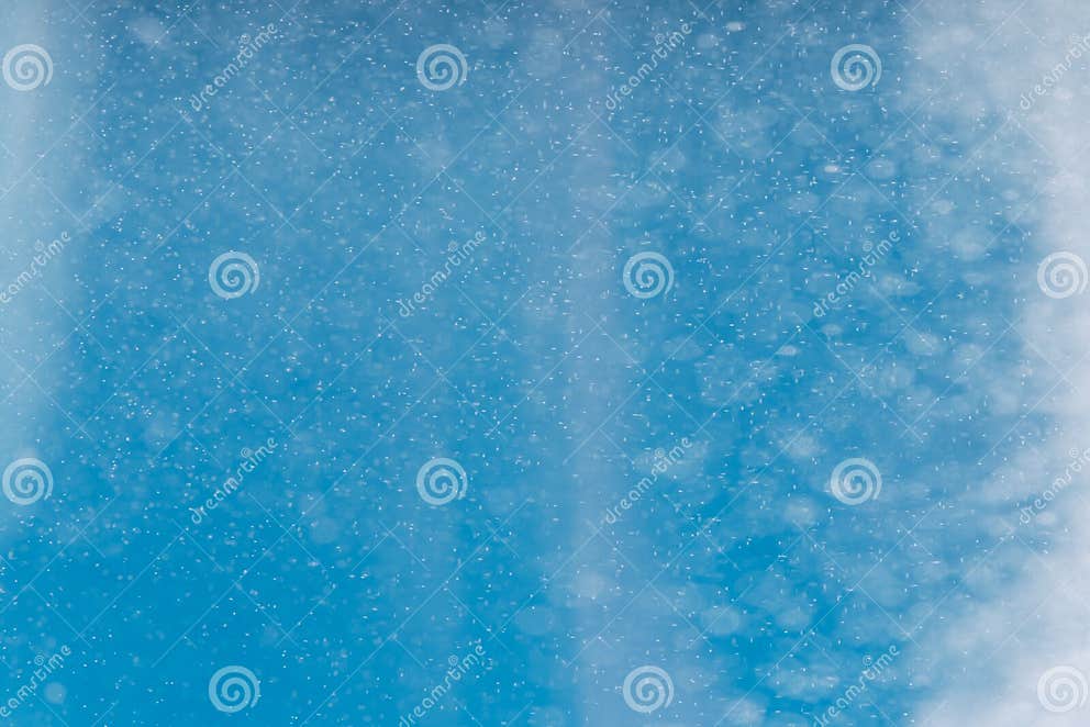 Background from Falling Blurry Snow Against Blue Sky Stock Photo ...