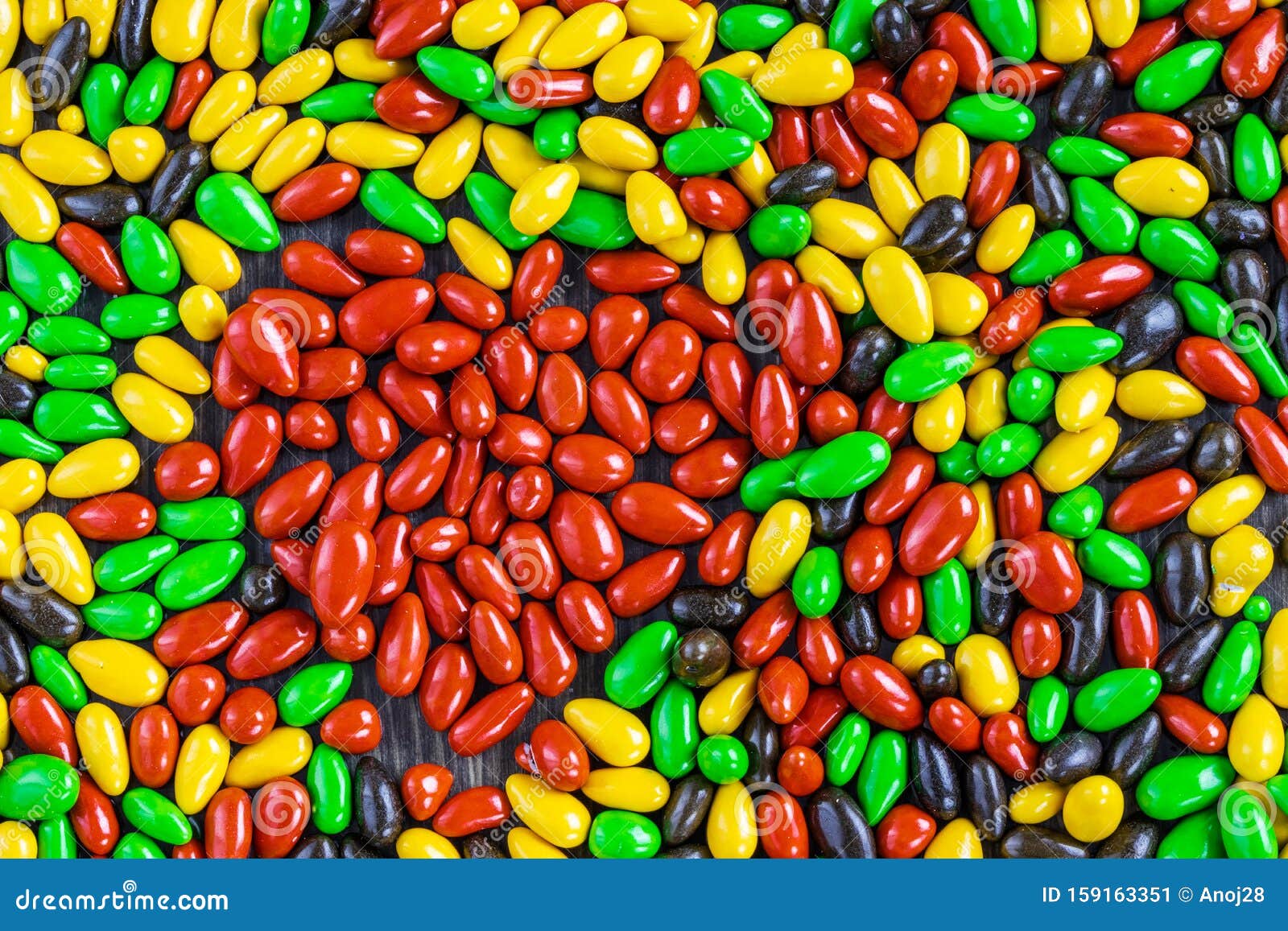 Background in the Form of Small Sweets of Milk Chocolate Covered with ...