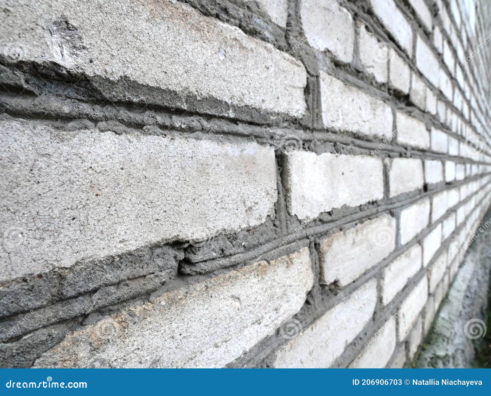 The Background is Gray Wall Made of White Unpainted Bricks. the ...