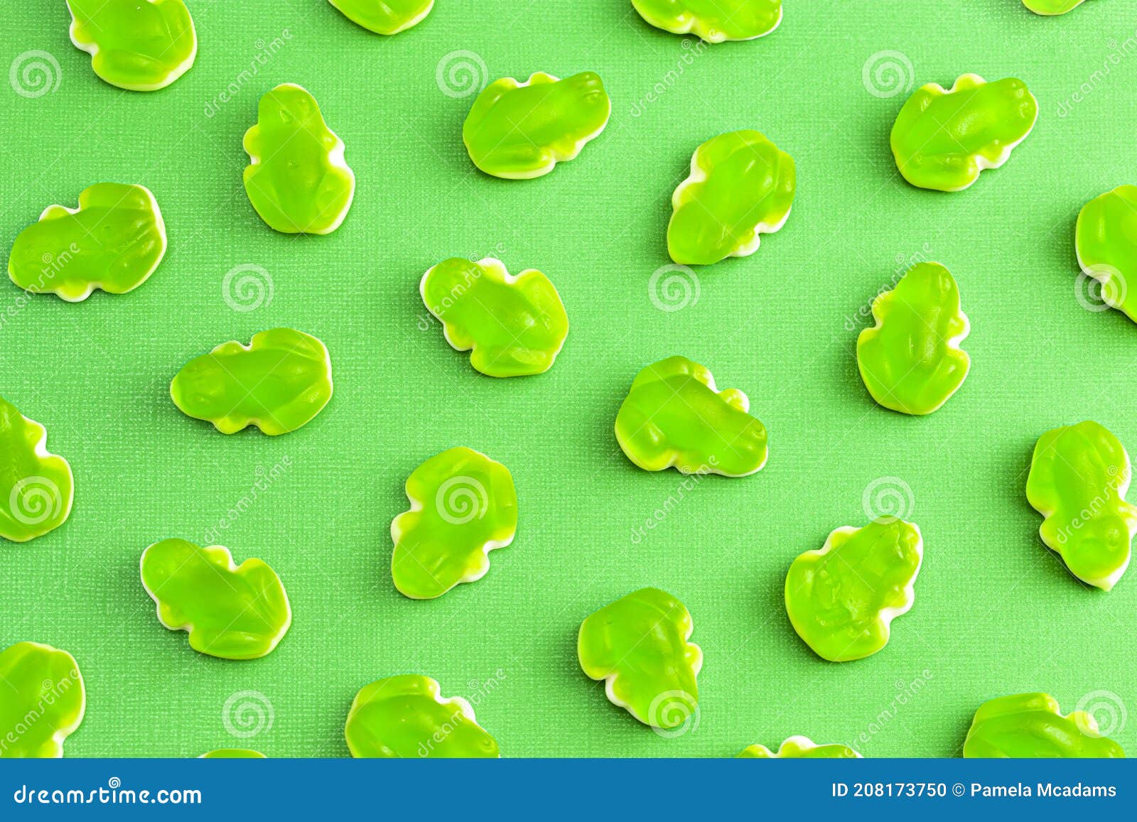 Background of Gummy Green Frogs with a Mashmallow Candy Bottom Layer ...