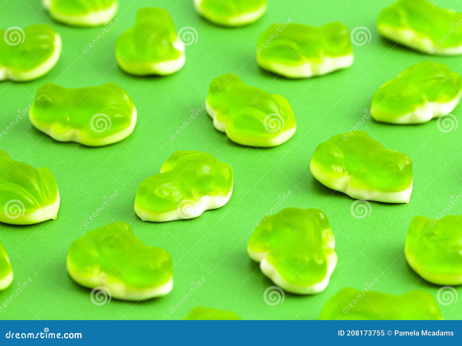 Background of Gummy Green Frogs with a Mashmallow Candy Bottom Layer ...