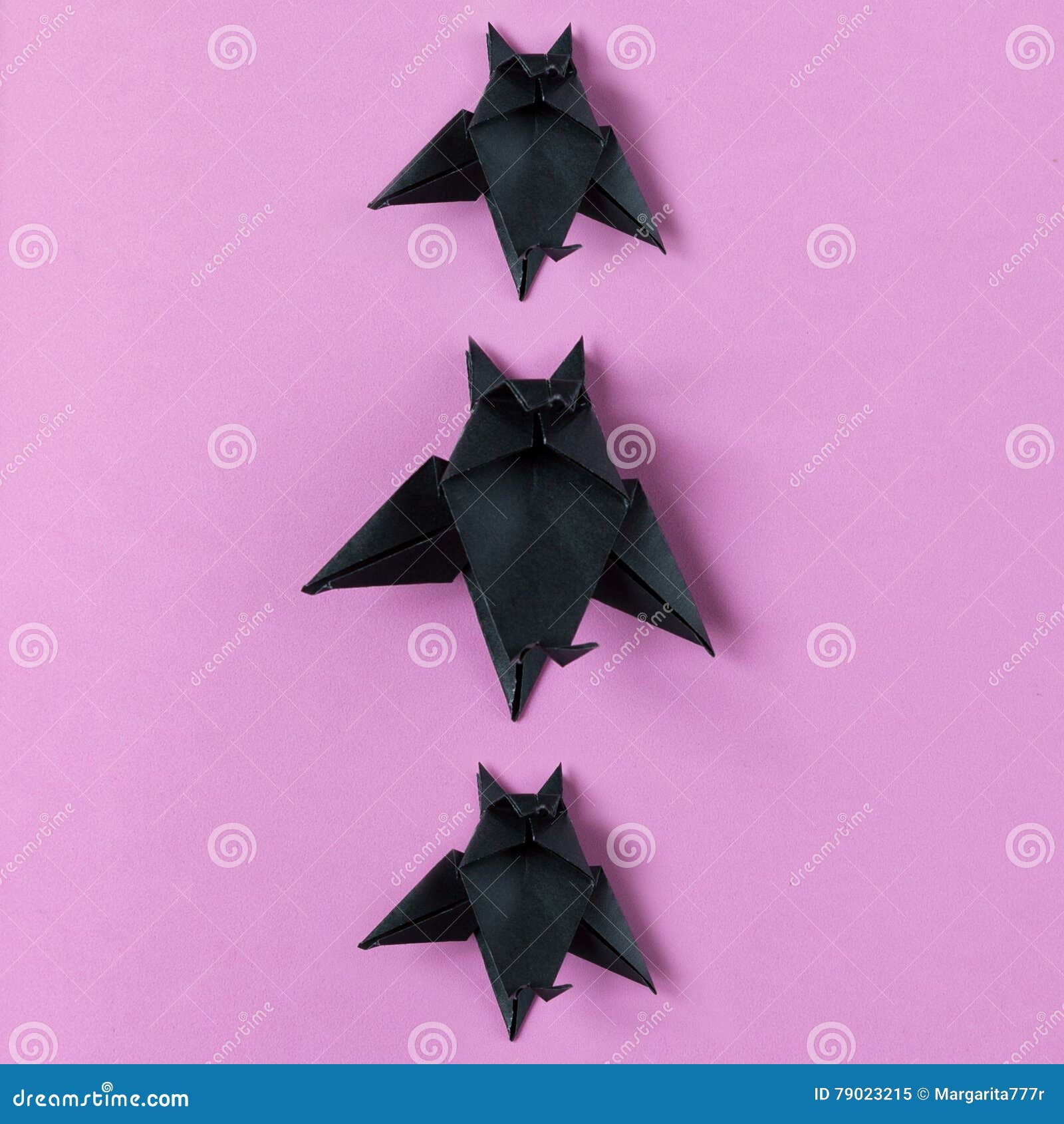 Halloween Origami - Black Paper Bat With Eyes And Teeth On A White ...