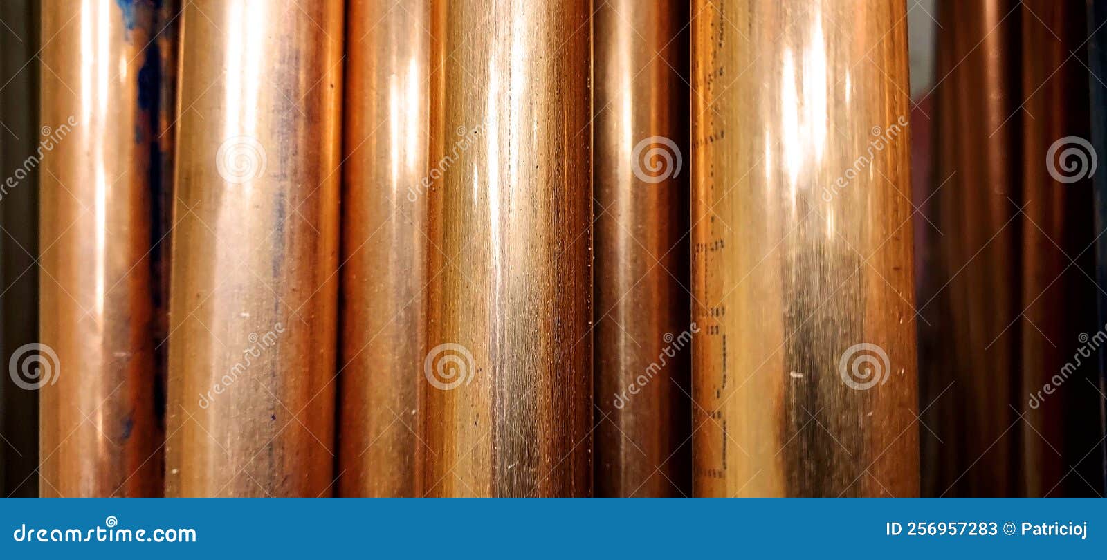 Background Image of Close-up Copper Water Pipes in a Vertical Line ...