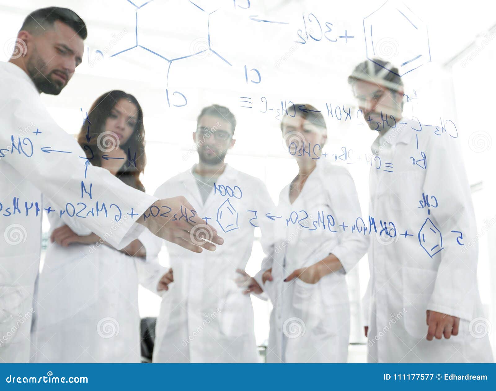 In the Background Image Group Laboratory Scientists Discussing Their ...