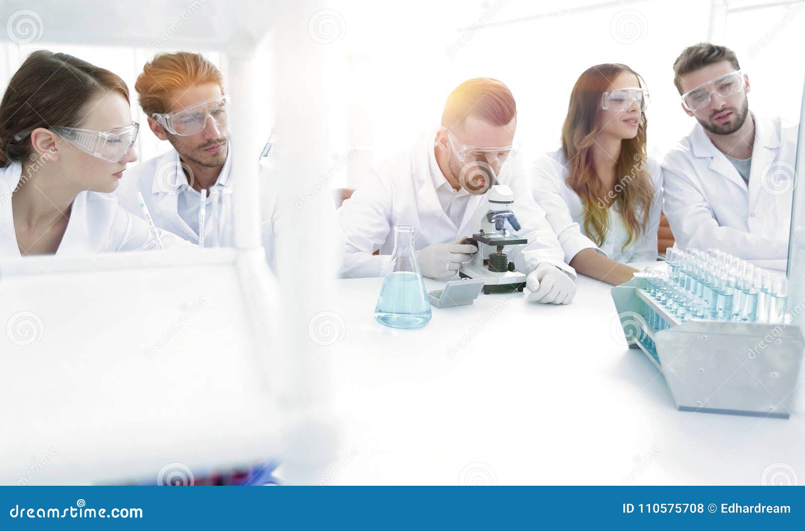 Background Image is a Group of Scientists Working in the Laboratory ...