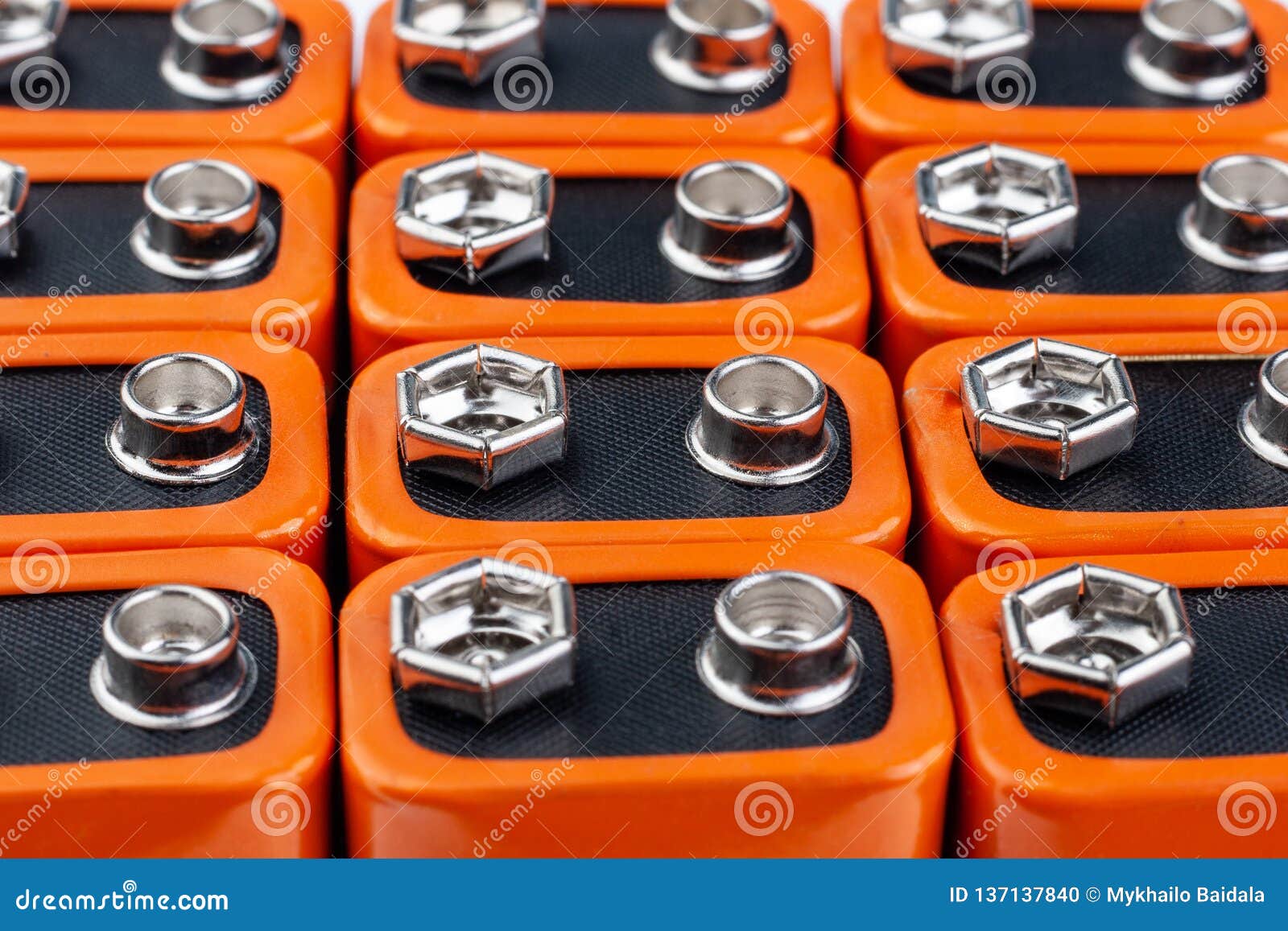 Background Image of a Large Number of Orange Batteries, Standing in ...