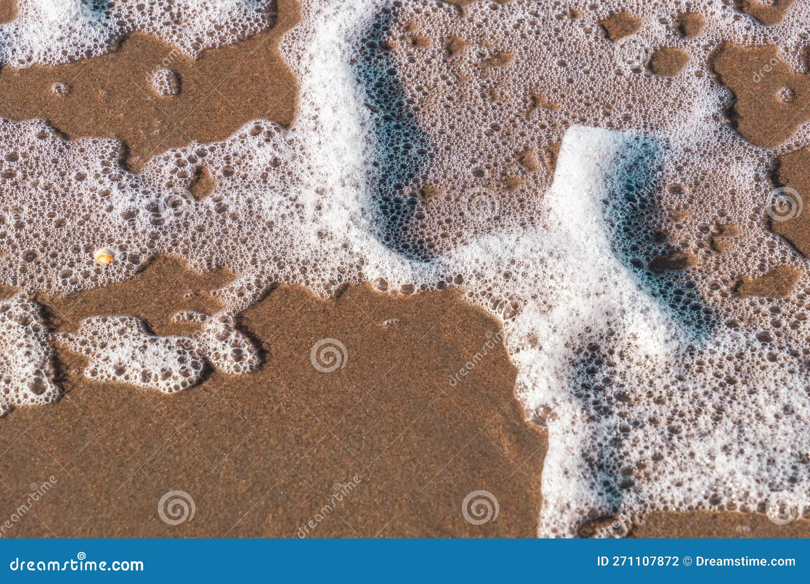 Sea Foam Patterns on the Beach on a Sunny Day Stock Photo - Image of ...
