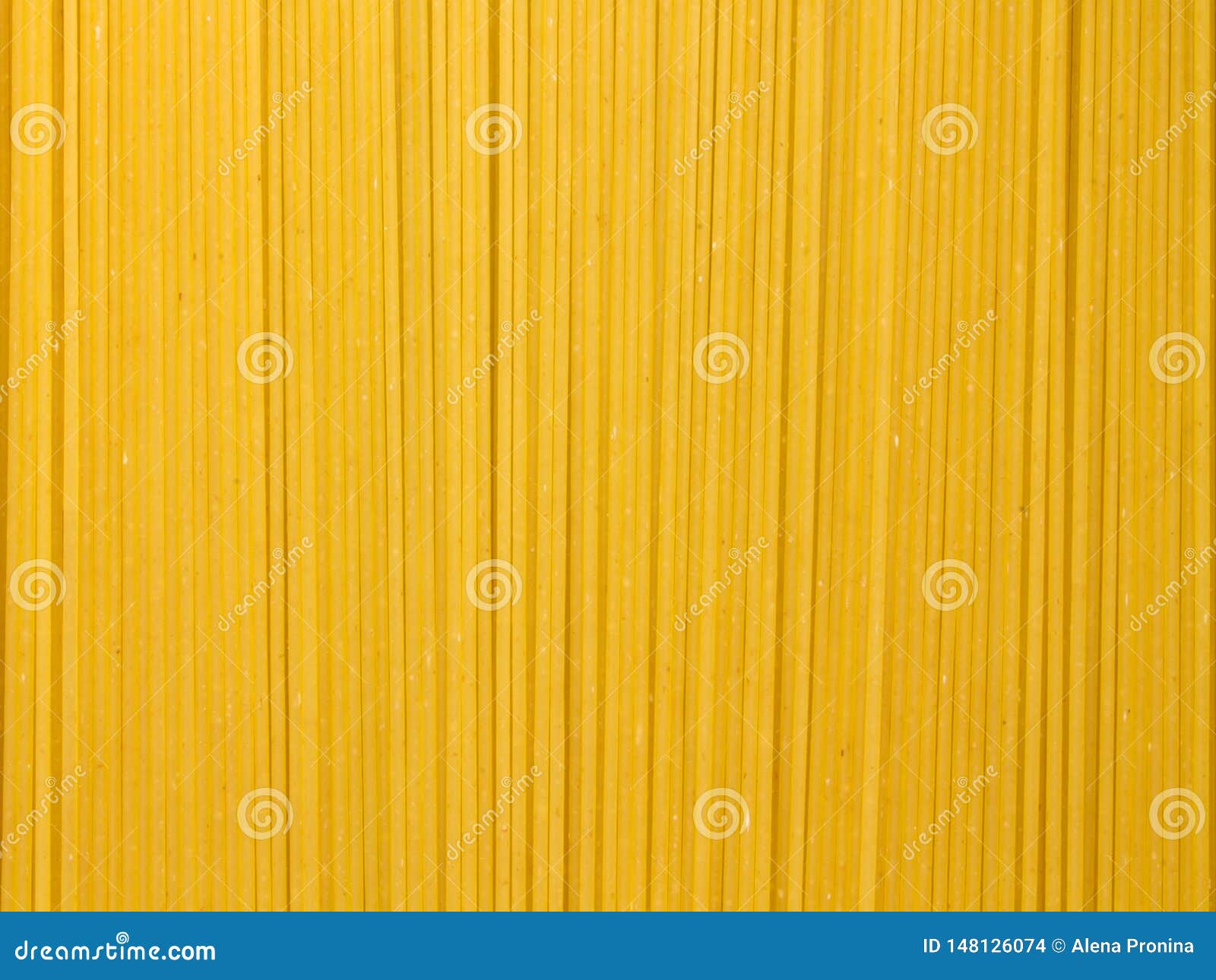Background of Long Raw Yellow Spaghetti Pasta in Vertical Plane Stock ...