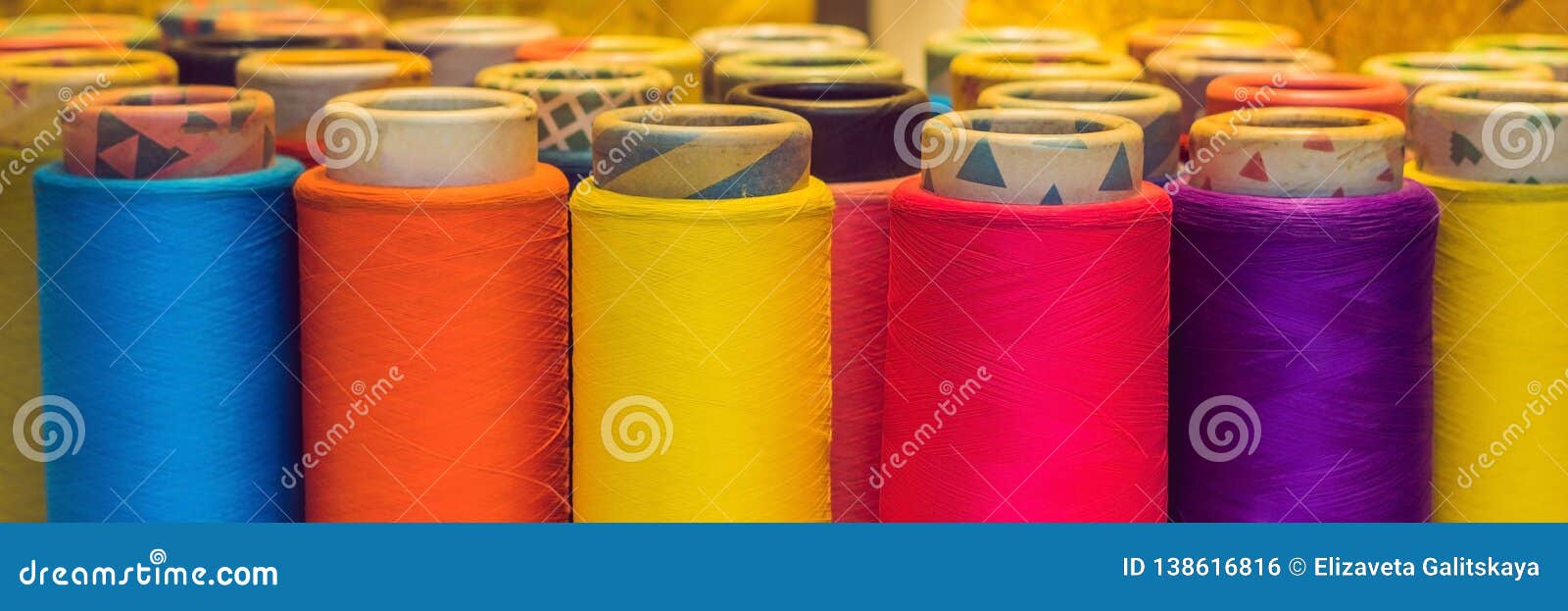 Background with a Lot of Colorful Coils with Threads. Bobbins are ...