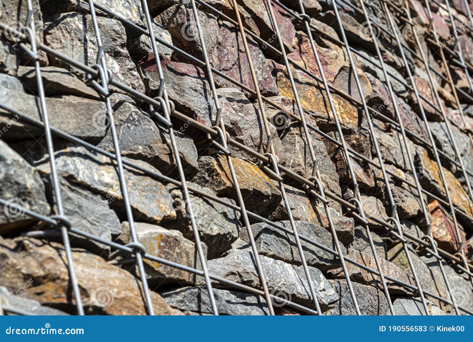 Background Made of a Stone Wall Secured with a Galvanized Metal Mesh ...