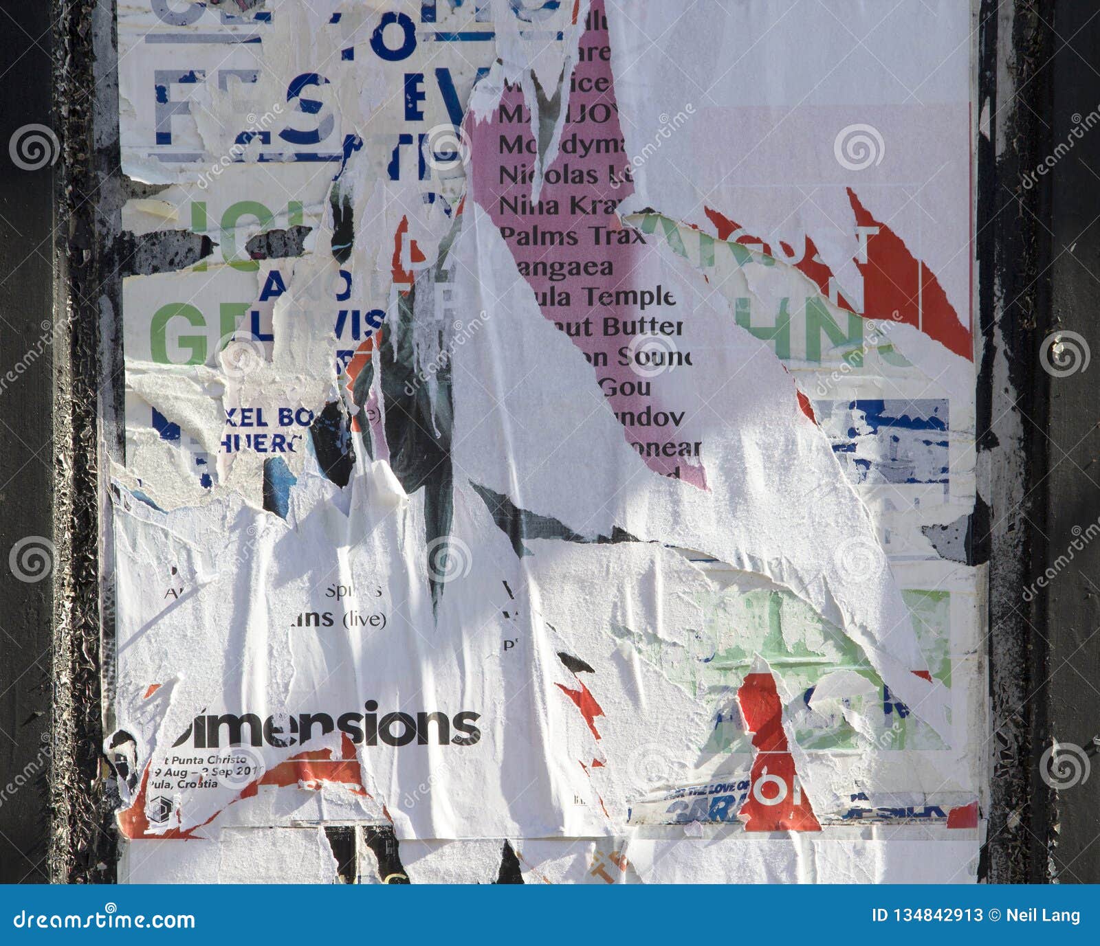 Torn posters on billboard editorial stock photo. Image of detail ...