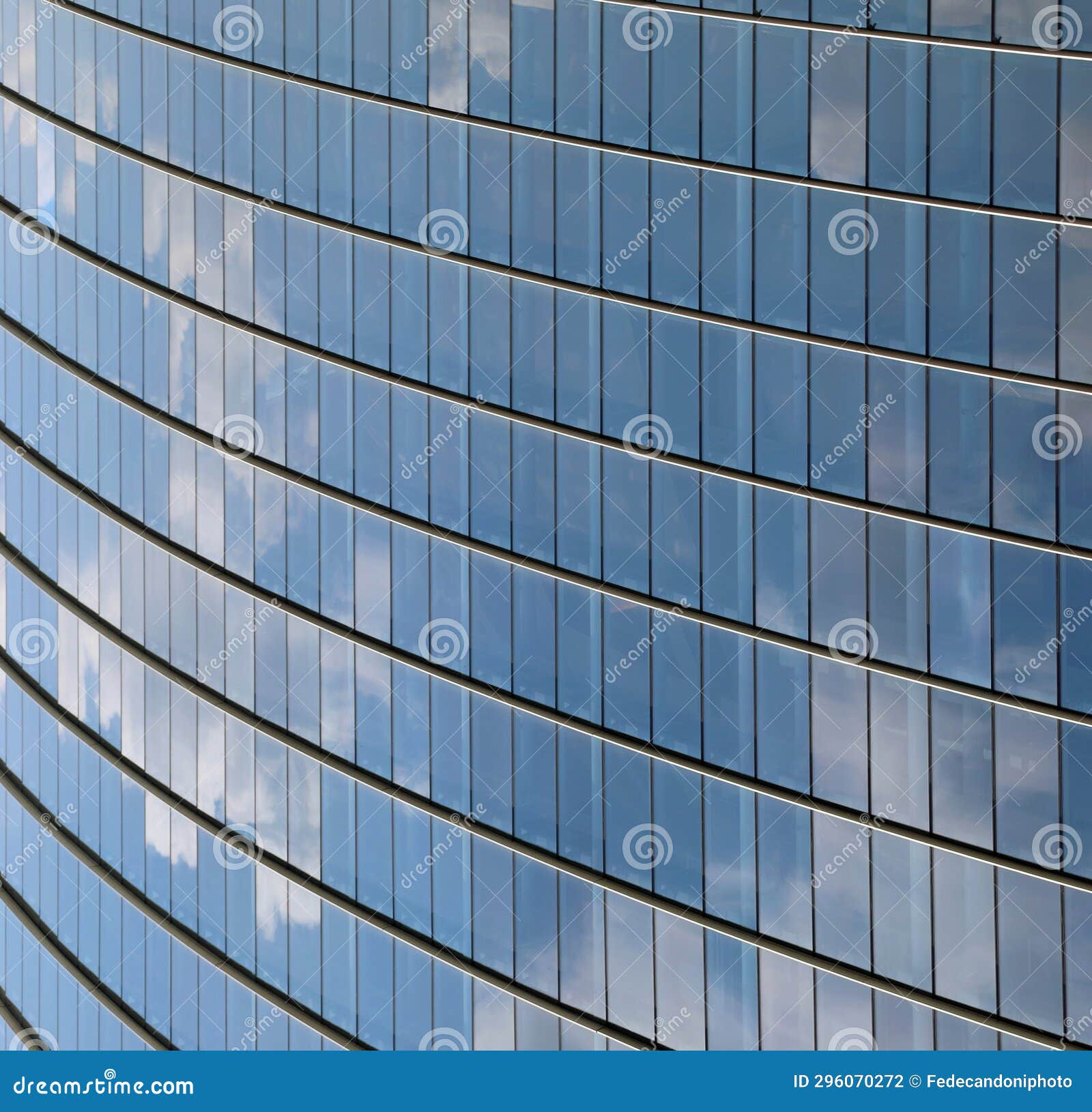 Background of Many Windows with Cloud Reflections on the Glass of a ...